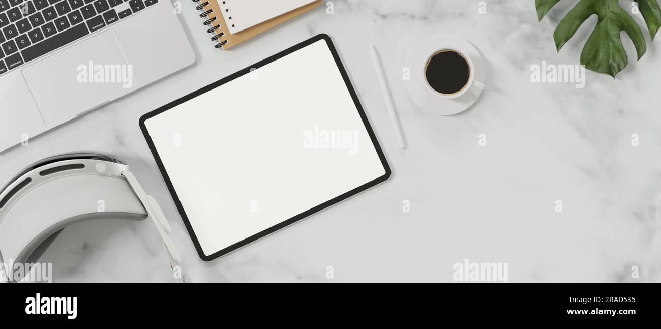 Top view of minimal workspace with blank screen mock up tablet, coffee ...