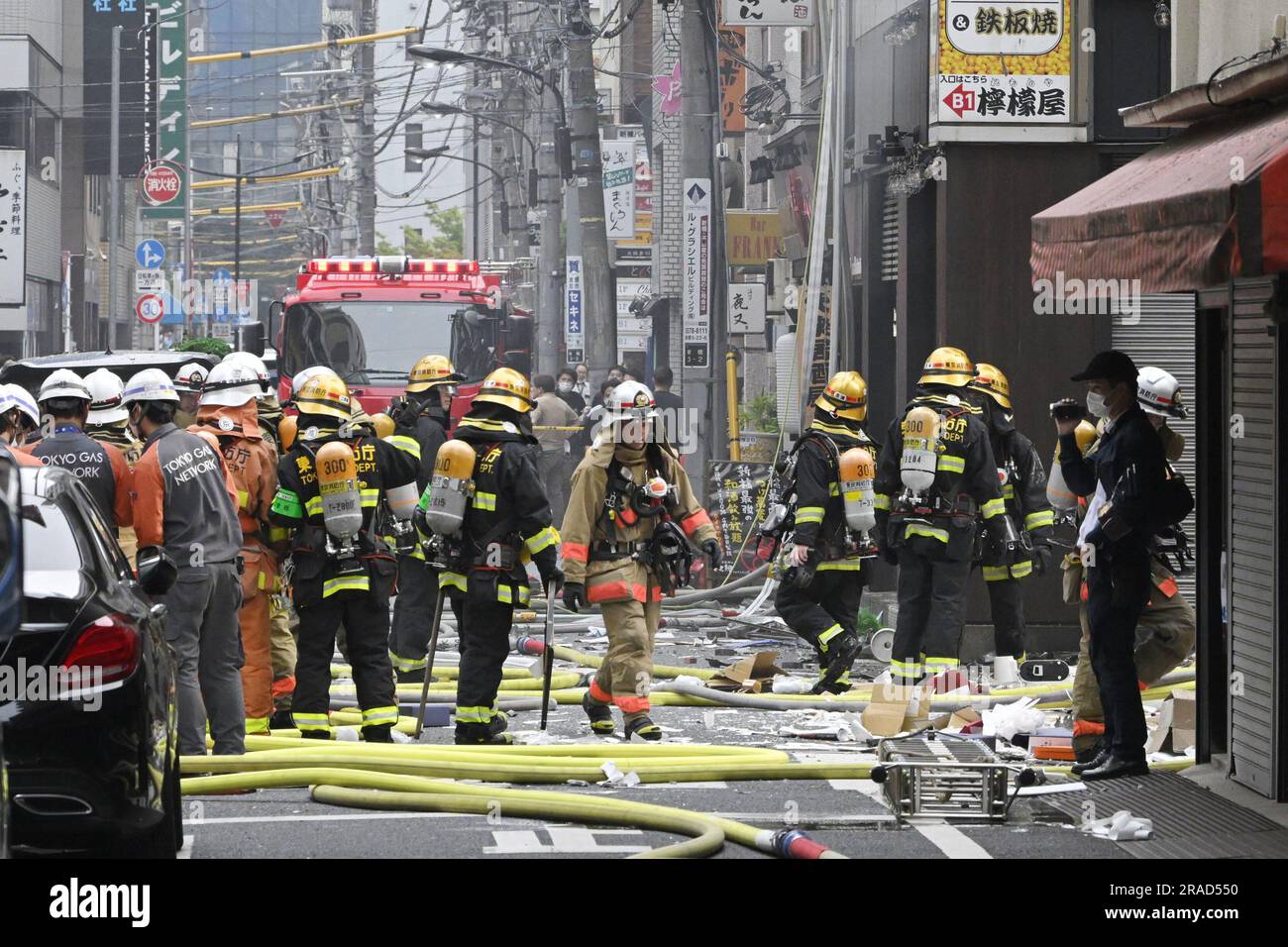 Firefighters gather at the scene of a fire in Tokyo's Shimbashi ...