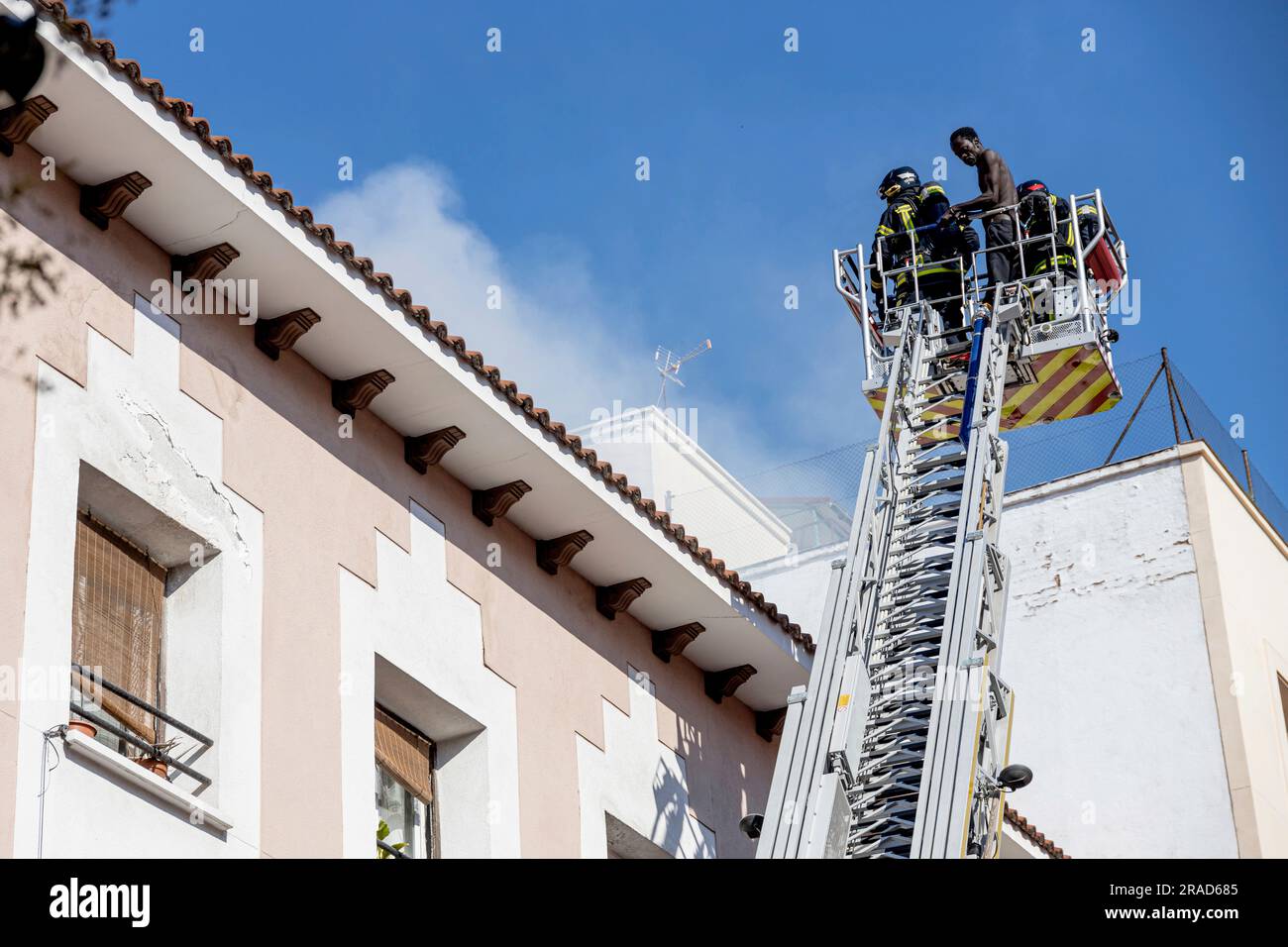 Firefighters on a crane during a fire without explosion that occurred ...