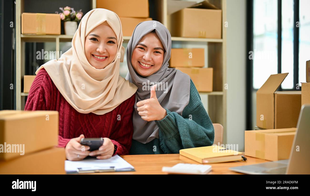 Young muslim online business team working together, showing a thumbs up ...