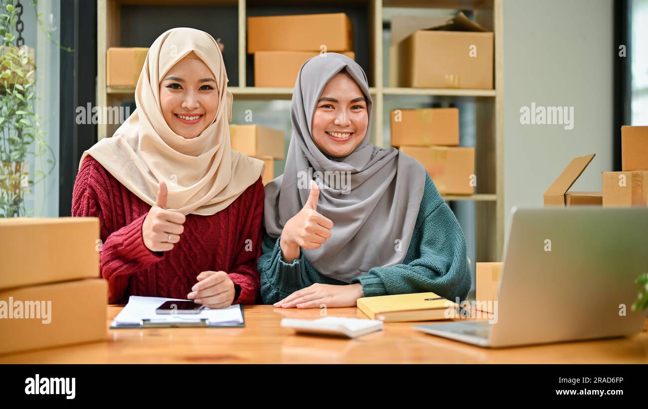 Young muslim online business team working together, showing a thumbs up ...
