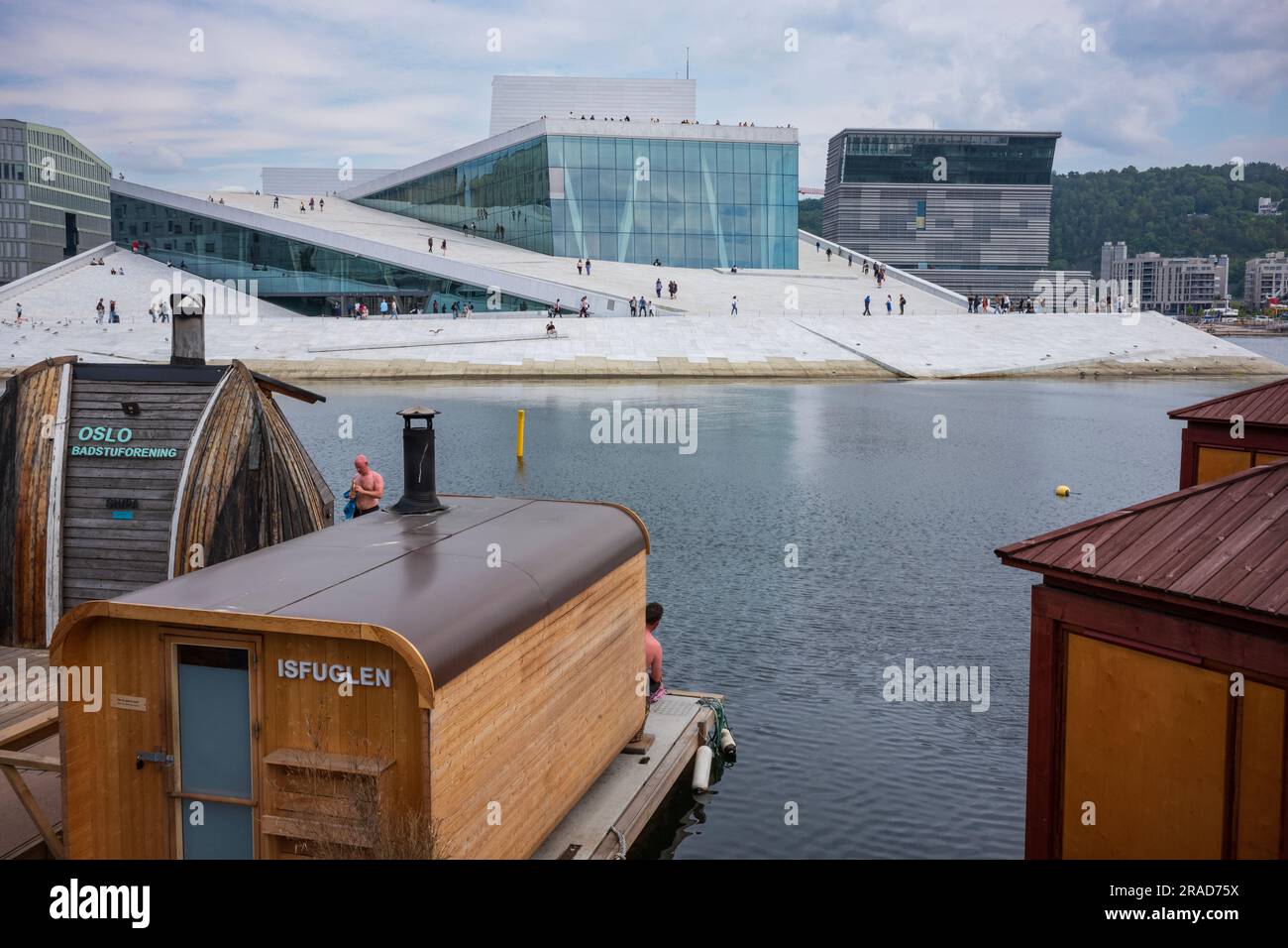 Oslo, Norway, June 20, 2023: Adults enjoy the floating sauna rafts of ...