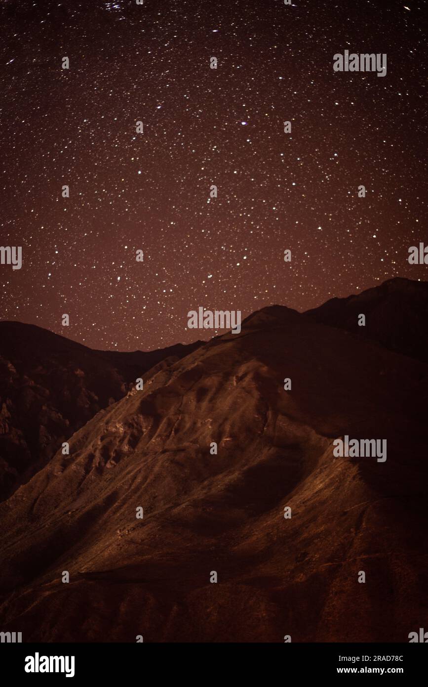 Stars shine bright above beautiful remote mountain range in peru Stock ...