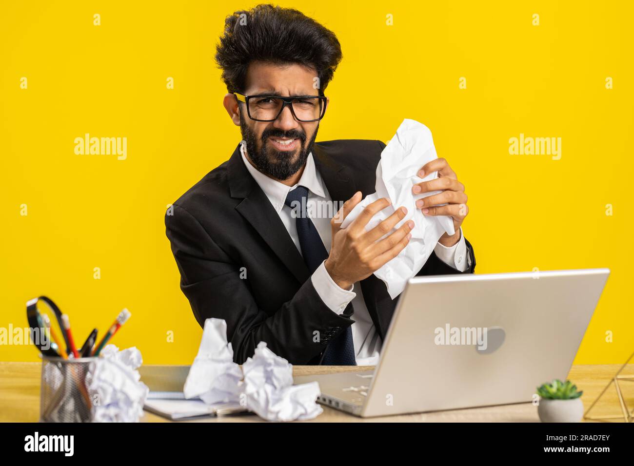 Angry furious indian man working at office throwing crumpled paper ...