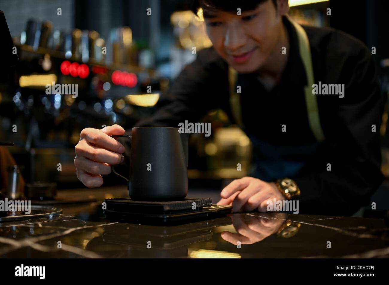 Handsome barista in uniform hi-res stock photography and images - Alamy