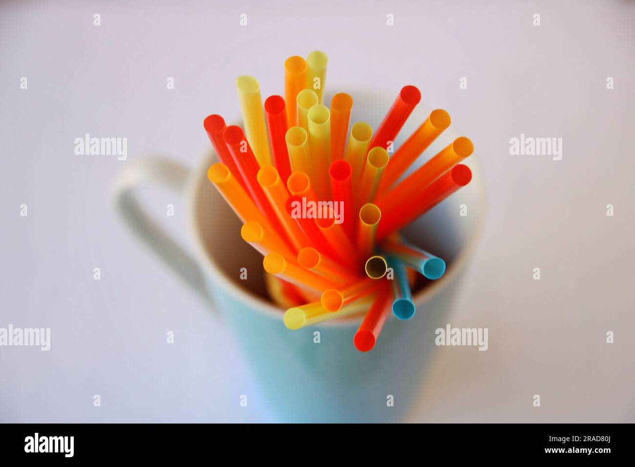 Glass full of colorful straws Stock Photo - Alamy