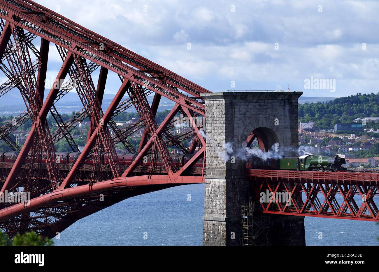 The Flying Scotsman passes over the Forth Bridge near Edinburgh in ...