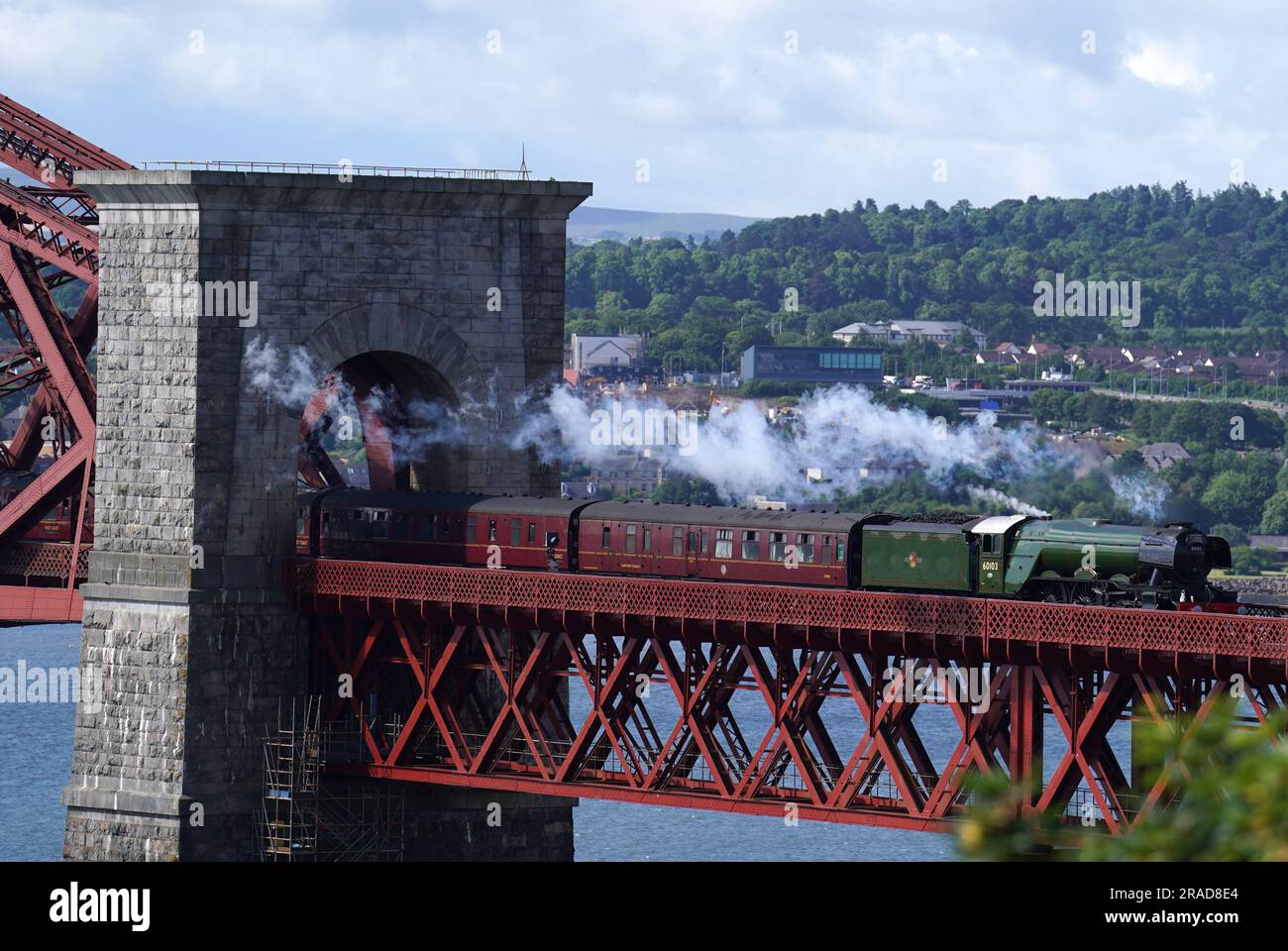 The Flying Scotsman passes over the Forth Bridge near Edinburgh in ...