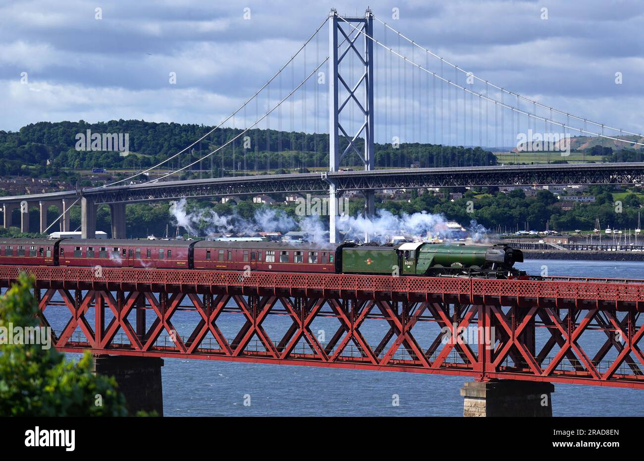The Flying Scotsman passes over the Forth Bridge near Edinburgh in ...
