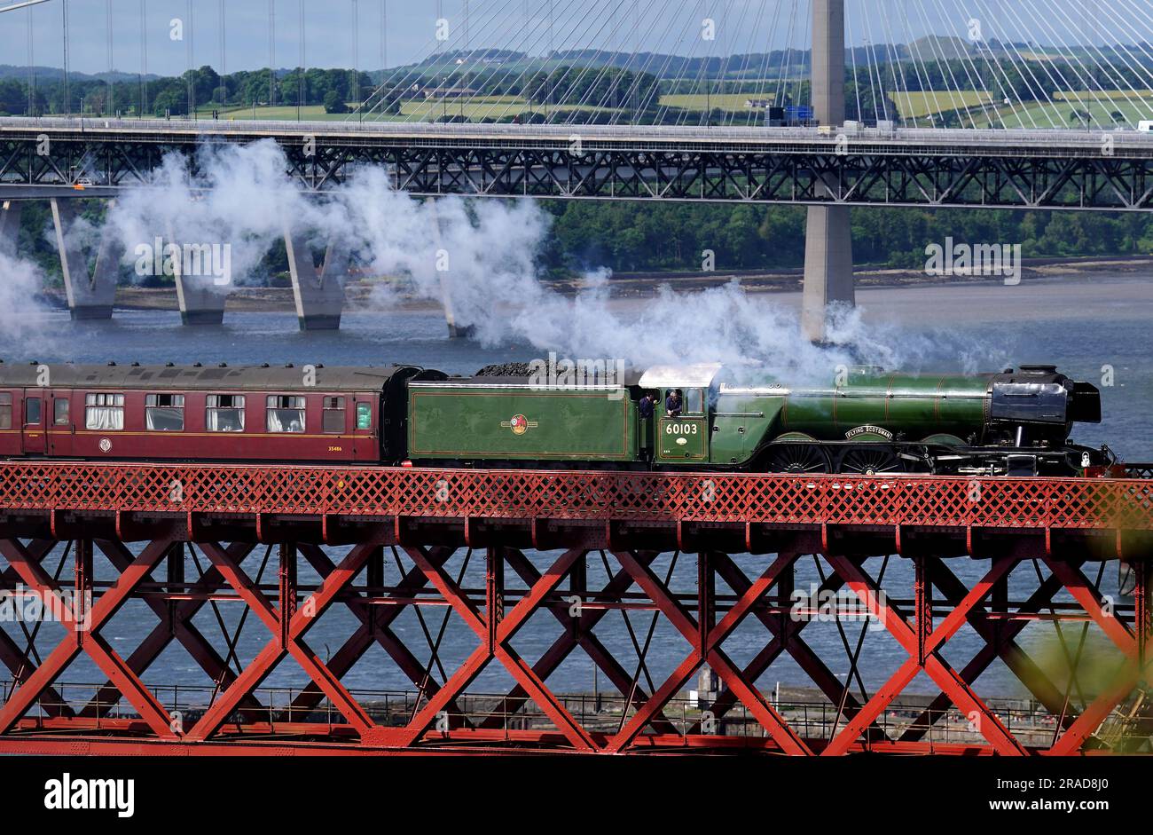 The Flying Scotsman passes over the Forth Bridge near Edinburgh in ...