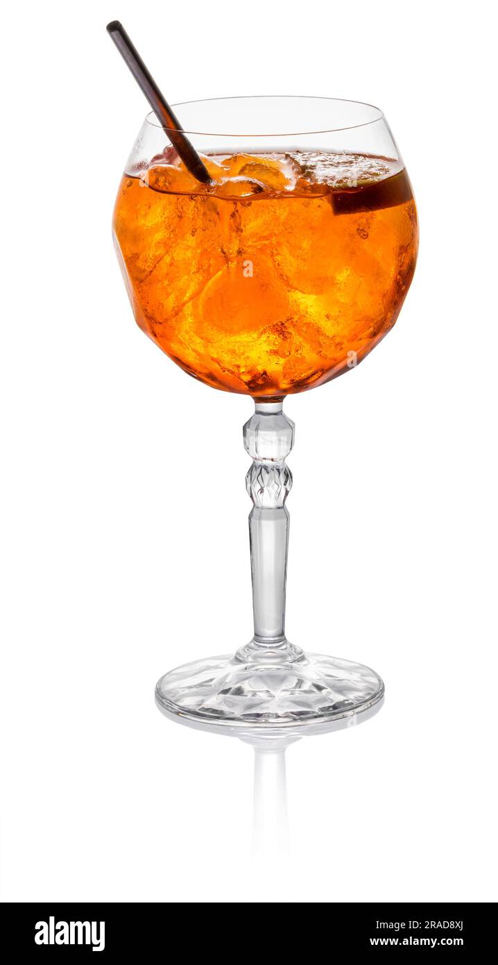 Orange Aperol spritz cocktail with ice cubes and straw served in glass ...