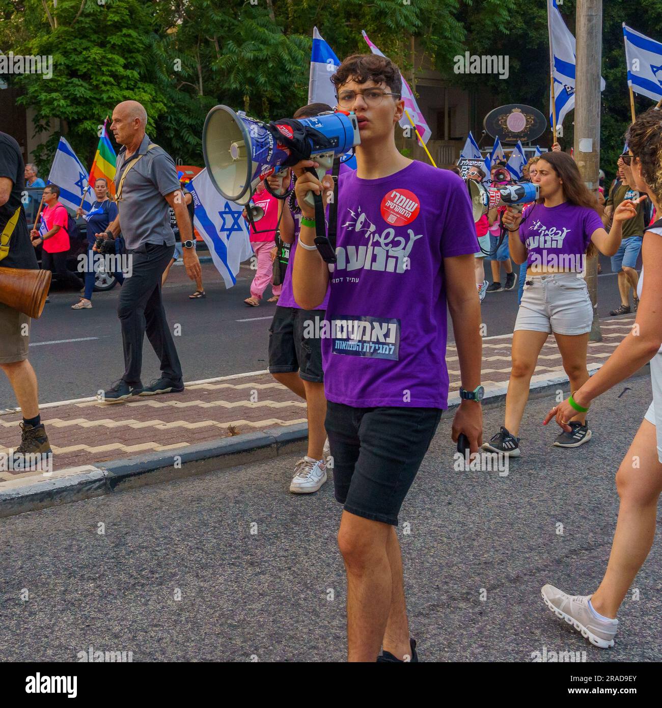 Haifa, Israel - July 01, 2023: People marching with flags and various ...