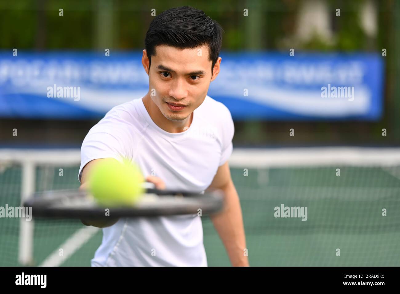Determined male tennis player holding racket and ball. Sport, training ...