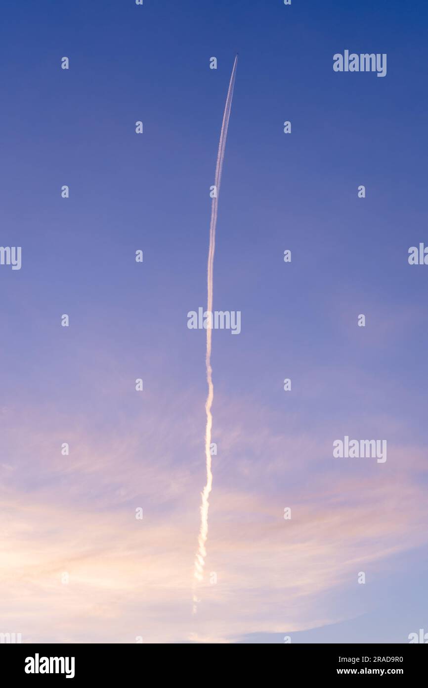 Sunset Plane Streak Stock Photo - Alamy
