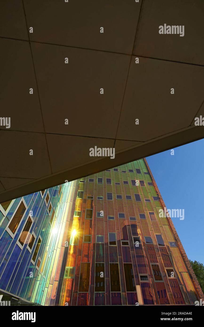 Amazing colourful reflective facade of a modern office building in sun ...