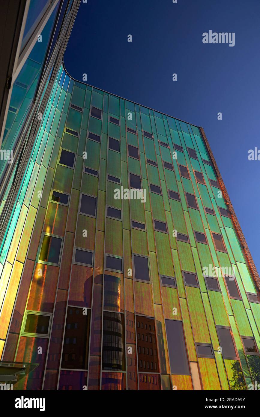 Amazing colourful reflective facade of a modern office building in sun ...