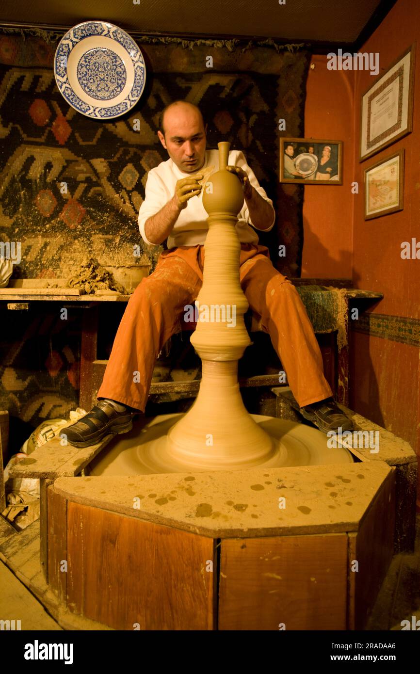 Master potter Ahmet at work inside the Firca Ceramics shop. Sultanahme ...