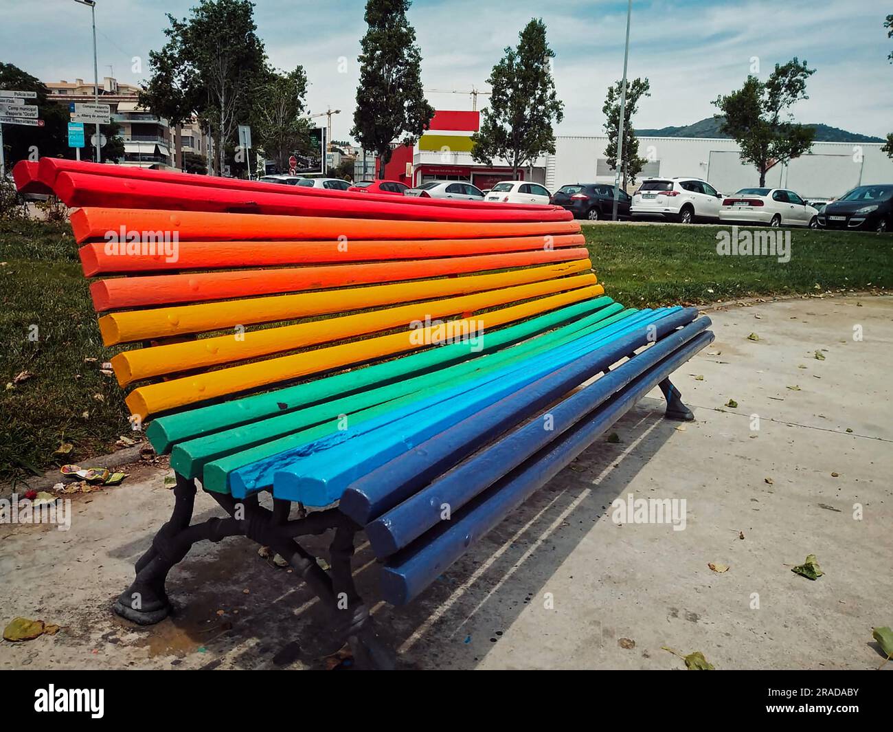 Wooden bench with the rainbow colors Stock Photo - Alamy