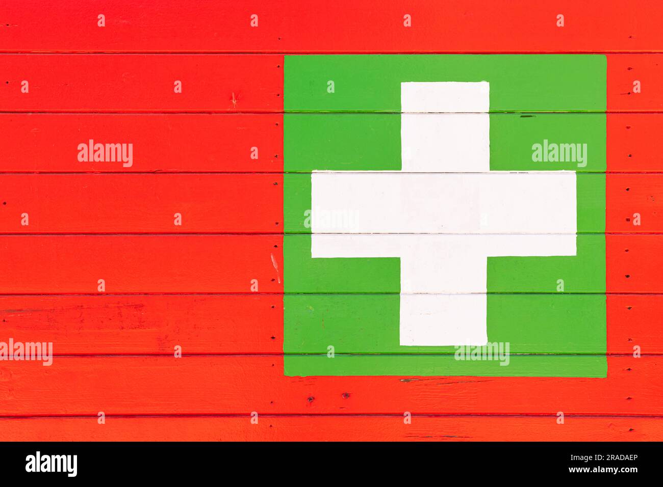 close-up medical care sign Medical care center. Door with a cross ...