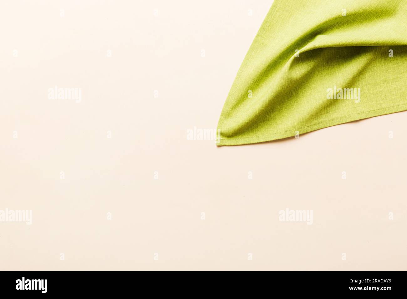 top view with green kitchen napkin isolated on table background. Folded ...