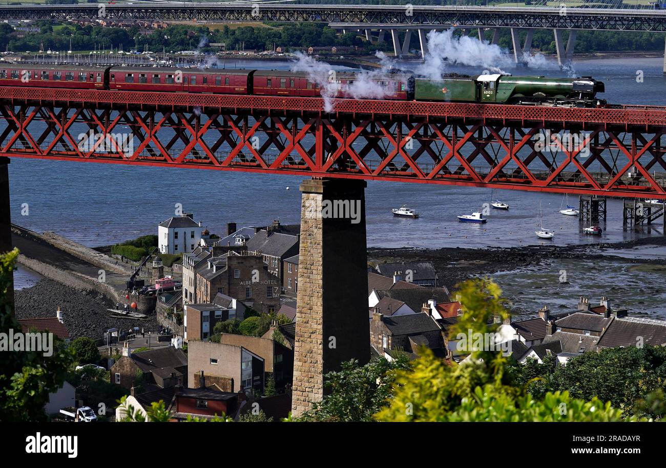 The Flying Scotsman passes over the Forth Bridge near Edinburgh in ...