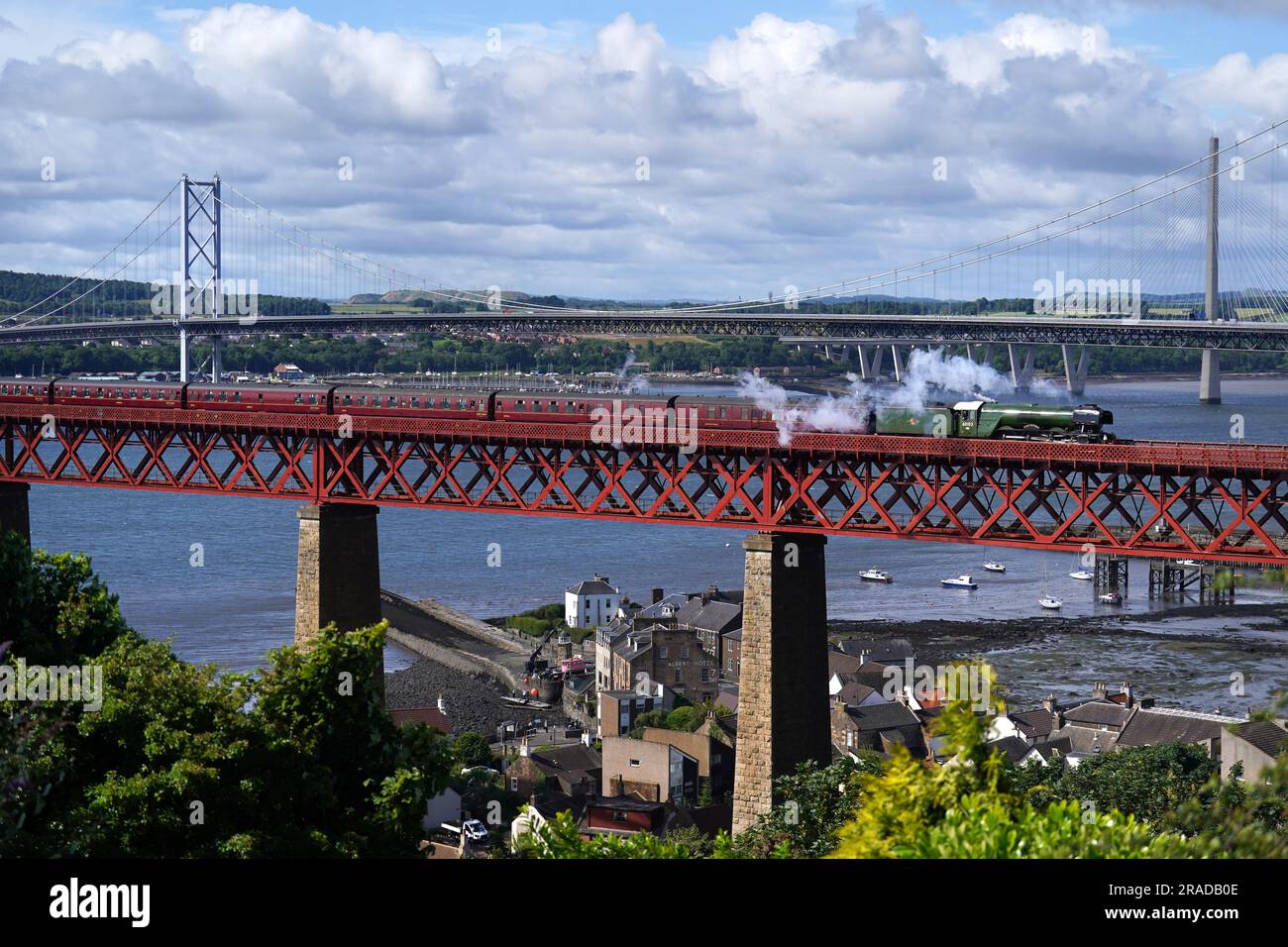 The Flying Scotsman passes over the Forth Bridge near Edinburgh in ...