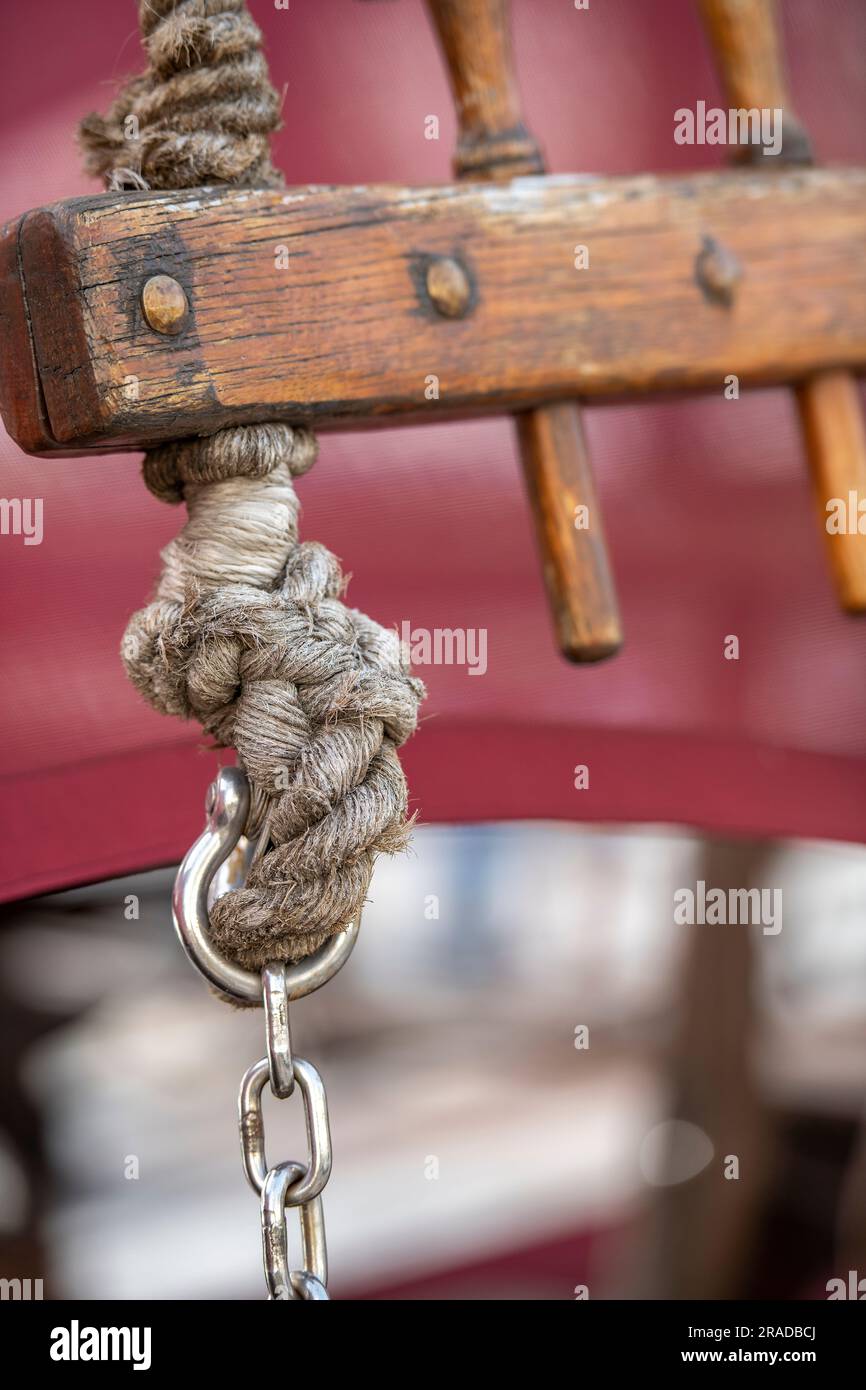 nautical or maritime equipment knotted rope and shackles on belaying ...
