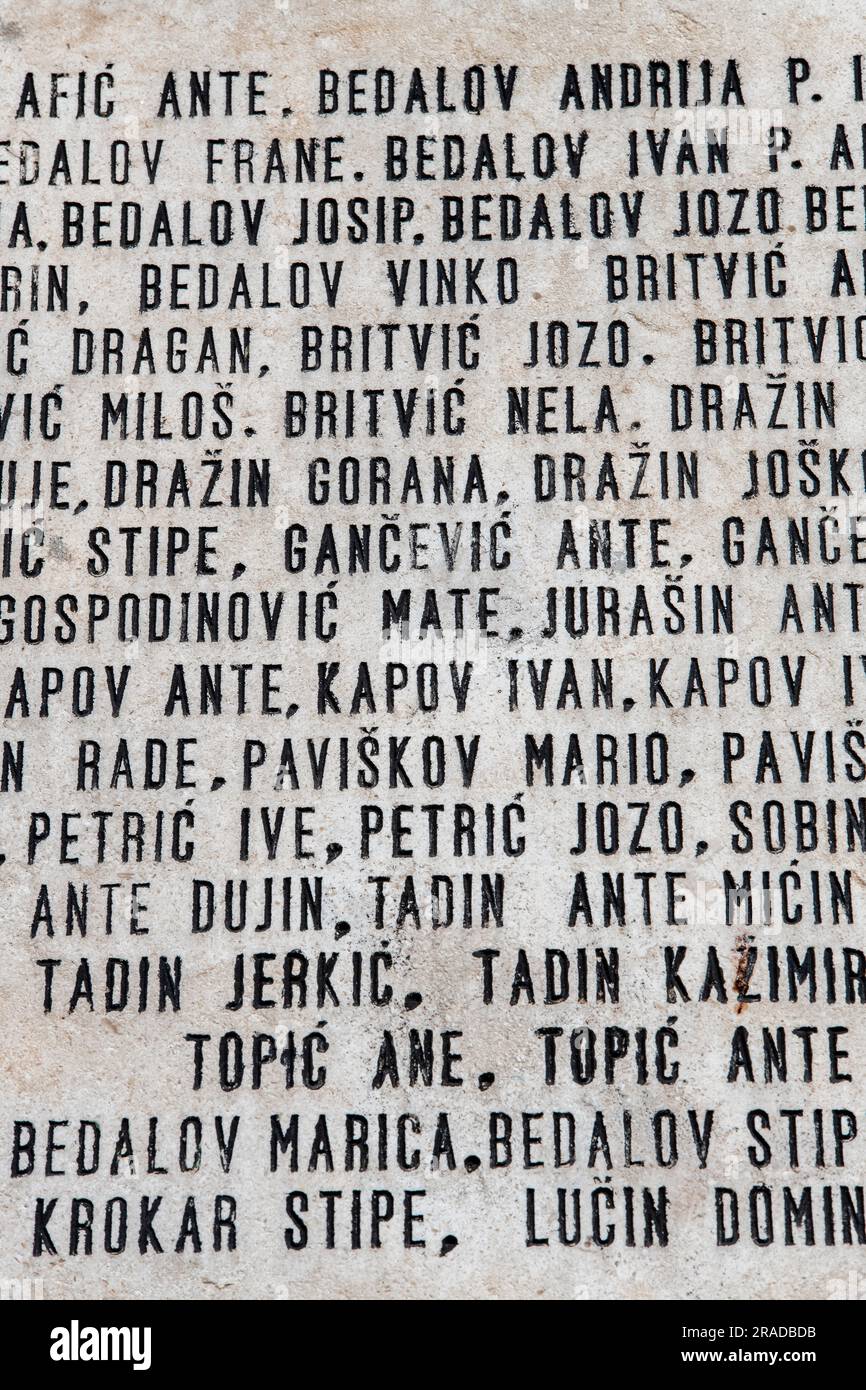 list of names on a croatian war memorial commemorating the lives lost in the balkan wars in the ...
