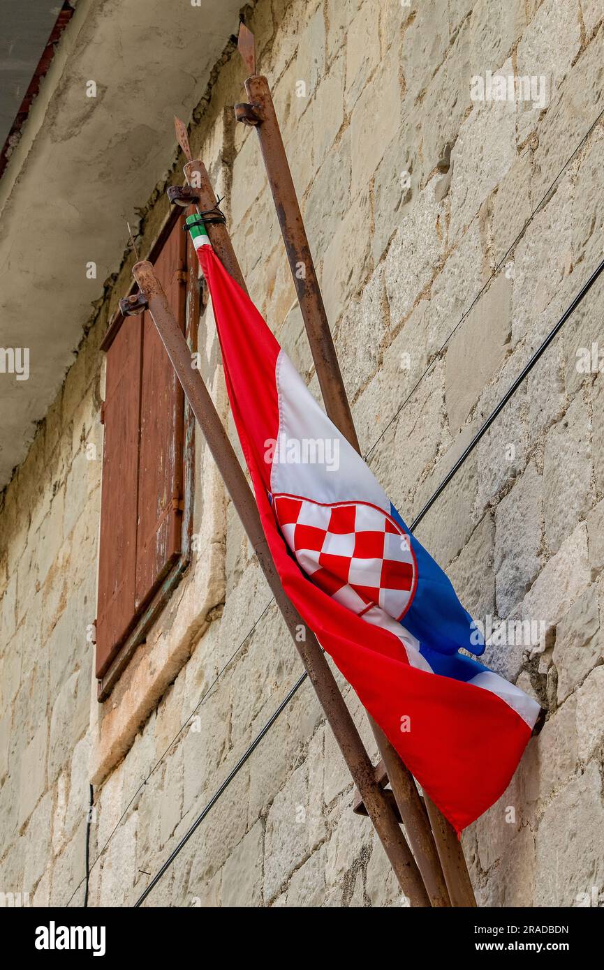 the croatian national flag flying on the outside of an historic ...