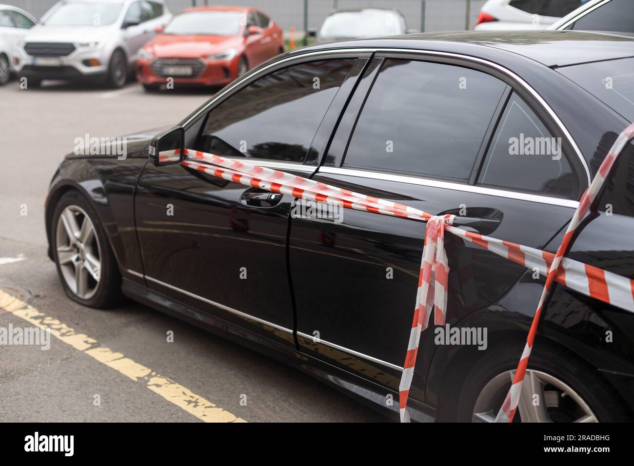 A car is wrapped in safety tapes Stock Photo - Alamy