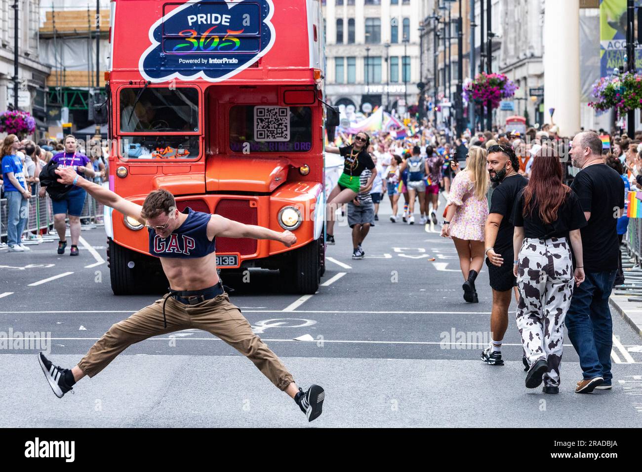 London, UK. 1st July, 2023. An acrobat performs in front of a double ...