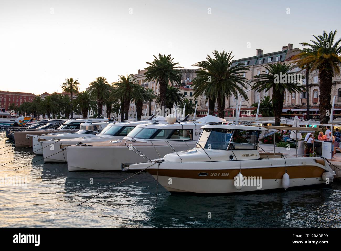 the harbour and promenade at grad split in croatia. modern tourists ...