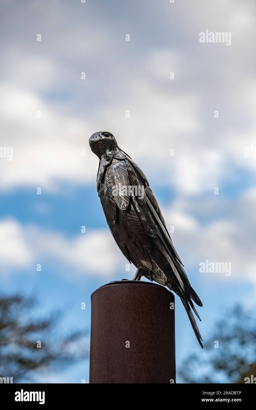 bronze model or sculpture of a large bird of prey sitting on a post at ...