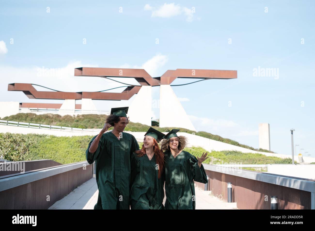 Group of university students celebrating their graduation outdoors ...