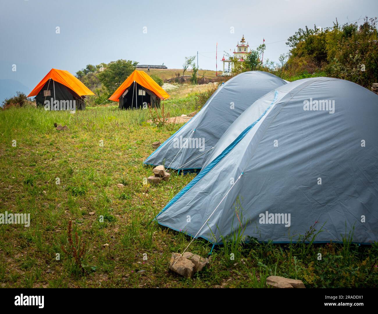 Camps with orange outer fly on a Camp Ground. Nag Tibba, Himalayan ...