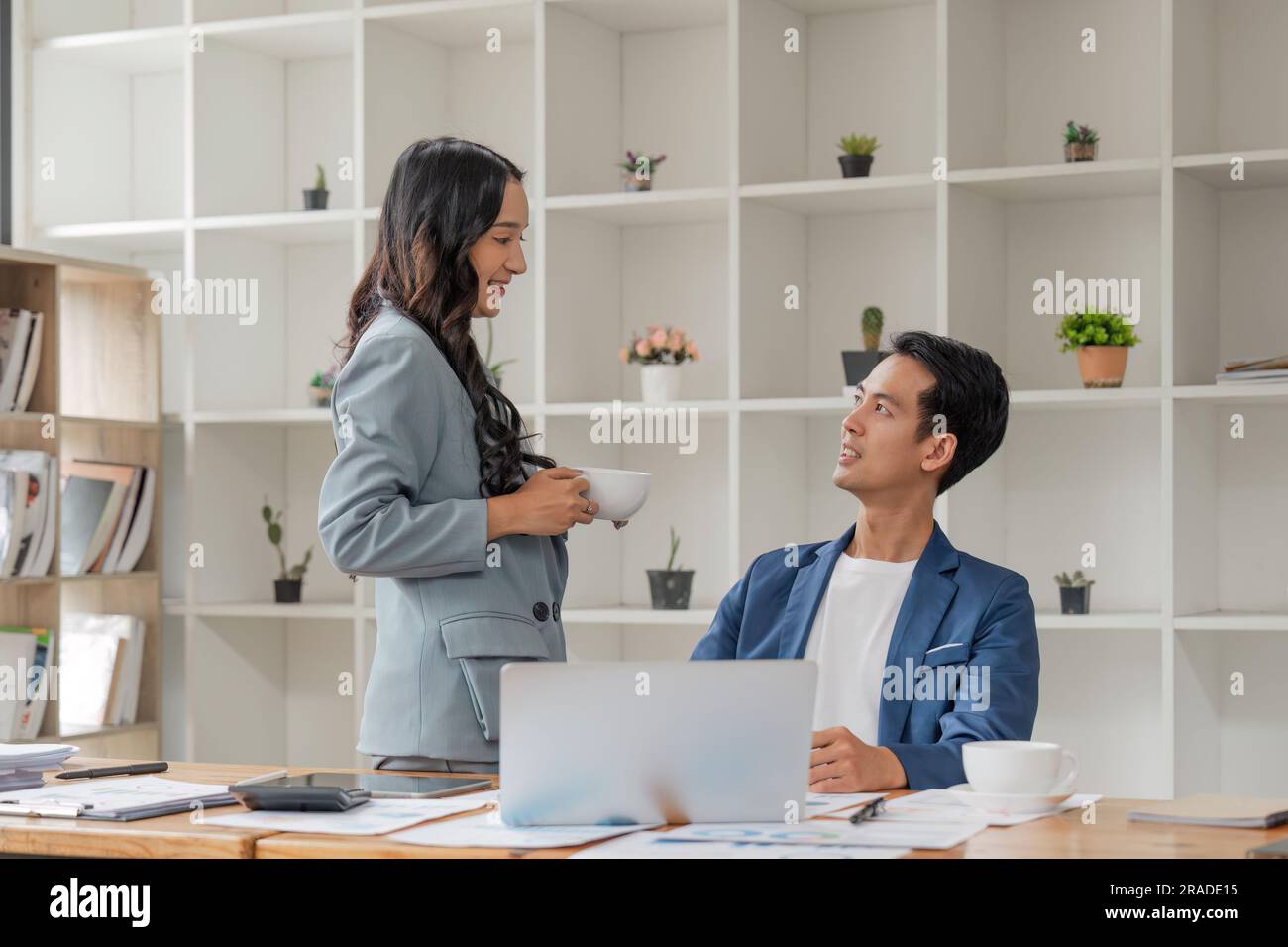 Two business people talk project strategy at office meeting room ...