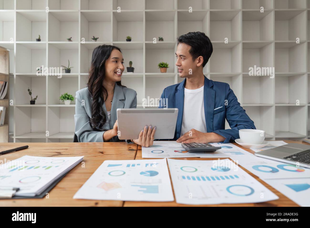 Two business people talk project strategy at office meeting room ...