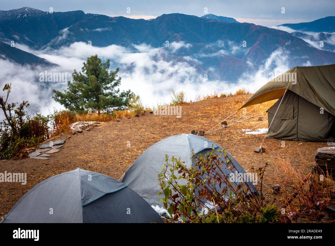 Camps with orange outer fly on a Camp Ground. Nag Tibba, Himalayan ...