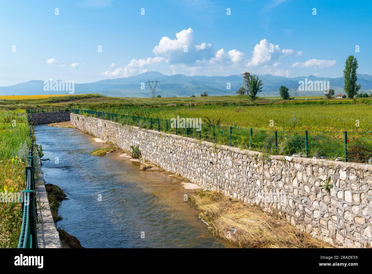 Stone wall built on the edge of the stream to protect from flooding ...