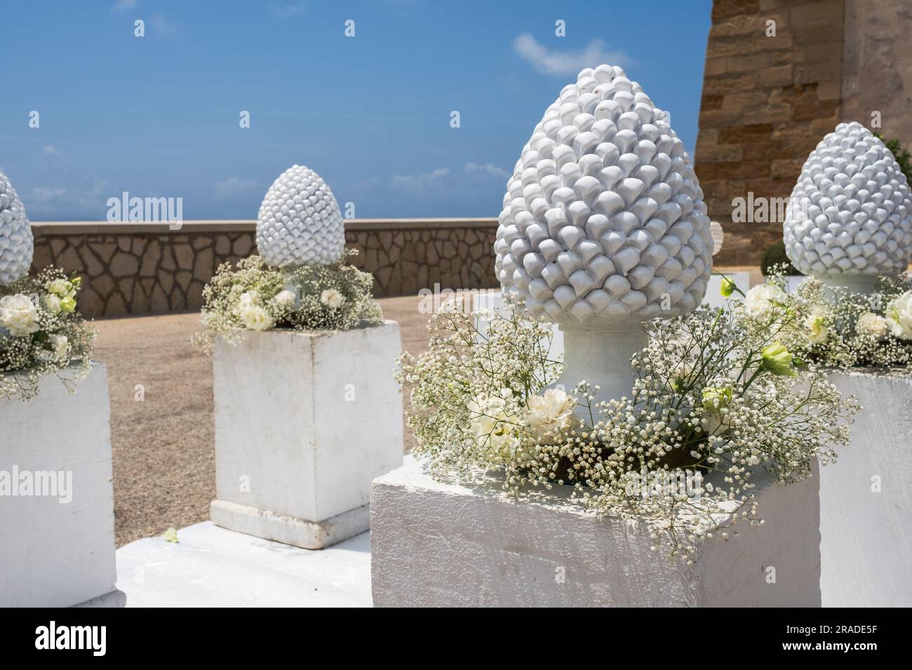 Flowers and ceramic pine cone arrangements, symbols of Sicily, wedding ...