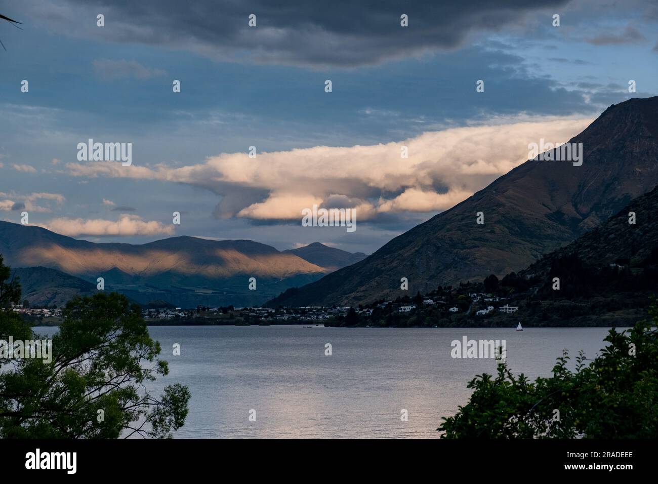 Beautiful evening clouds and shafts of sunlight over Frankton and ...