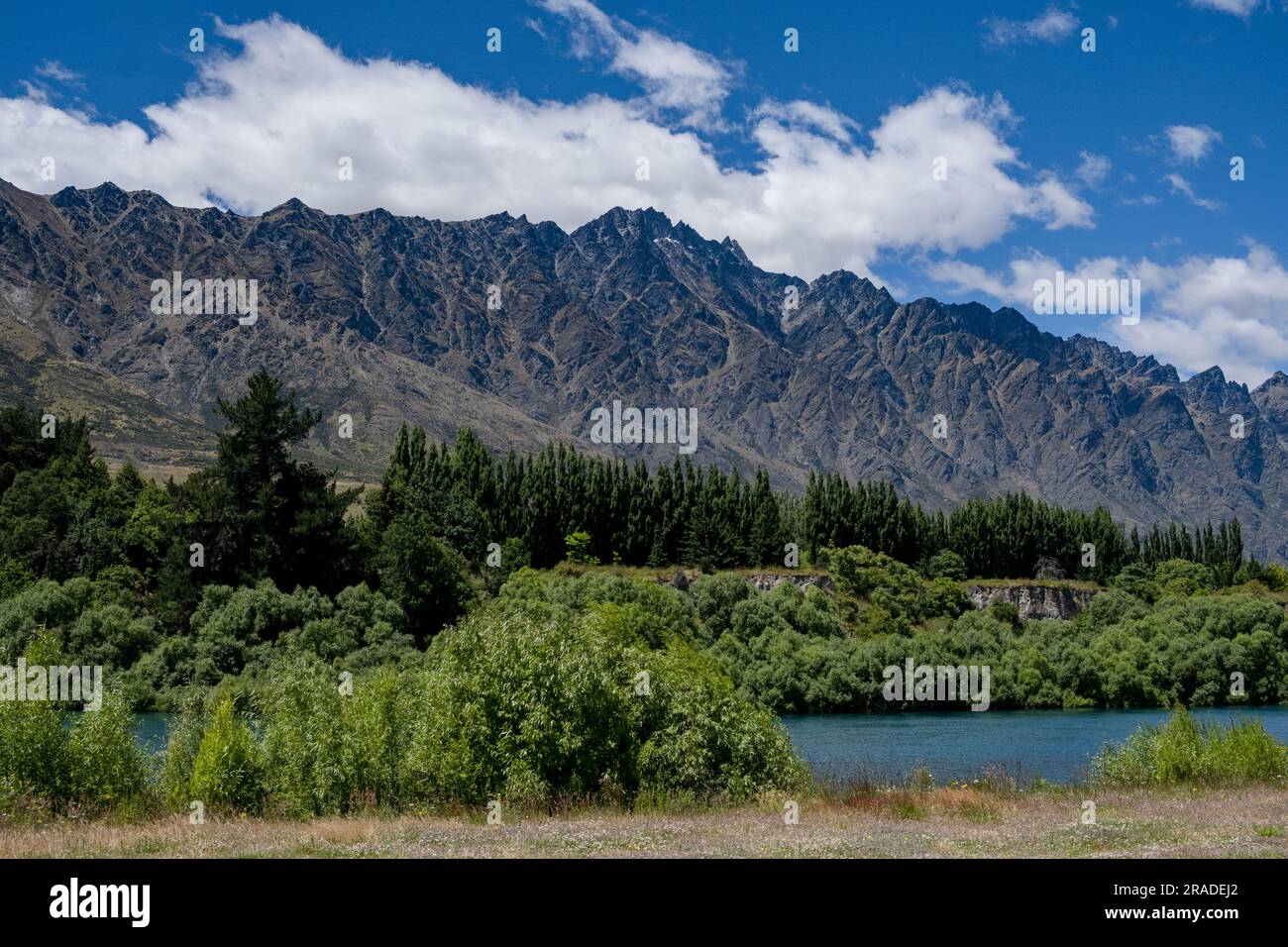The iconic Remarkables Mountains viewed above the popular cycle path ...