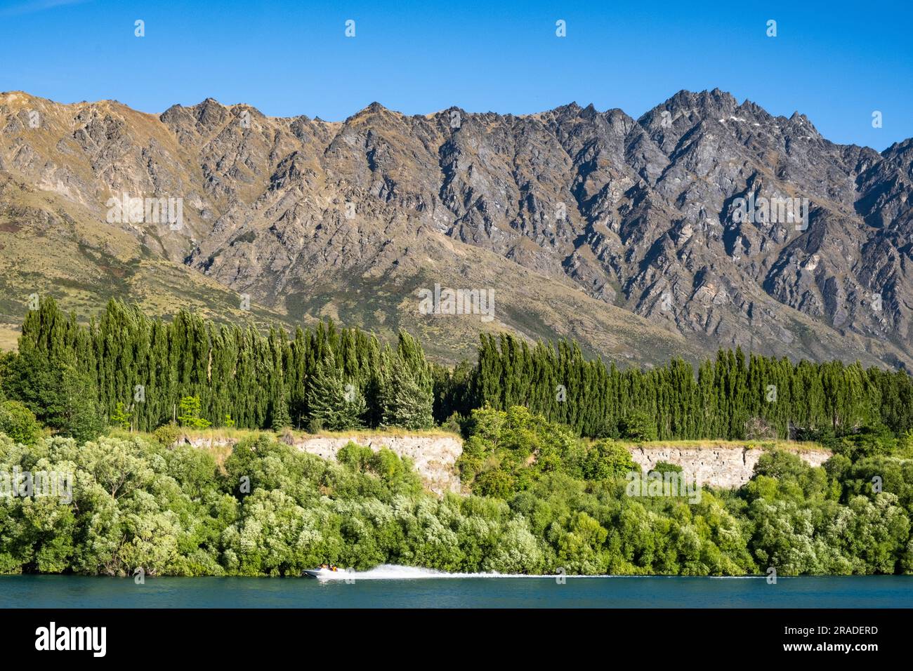 The iconic Remarkables Mountains viewed above the popular cycle path ...