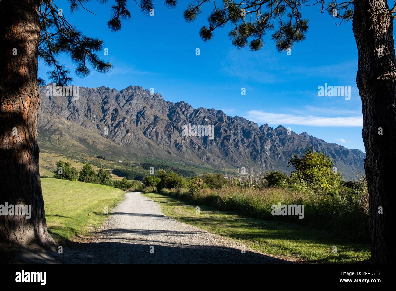 The iconic Remarkables Mountains viewed above the popular cycle path ...