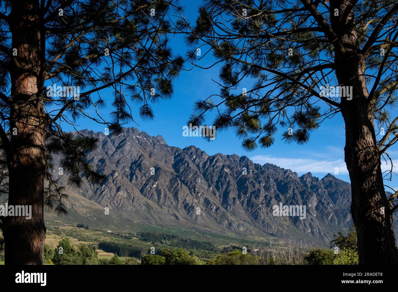 The iconic Remarkables Mountains viewed above the popular cycle path ...