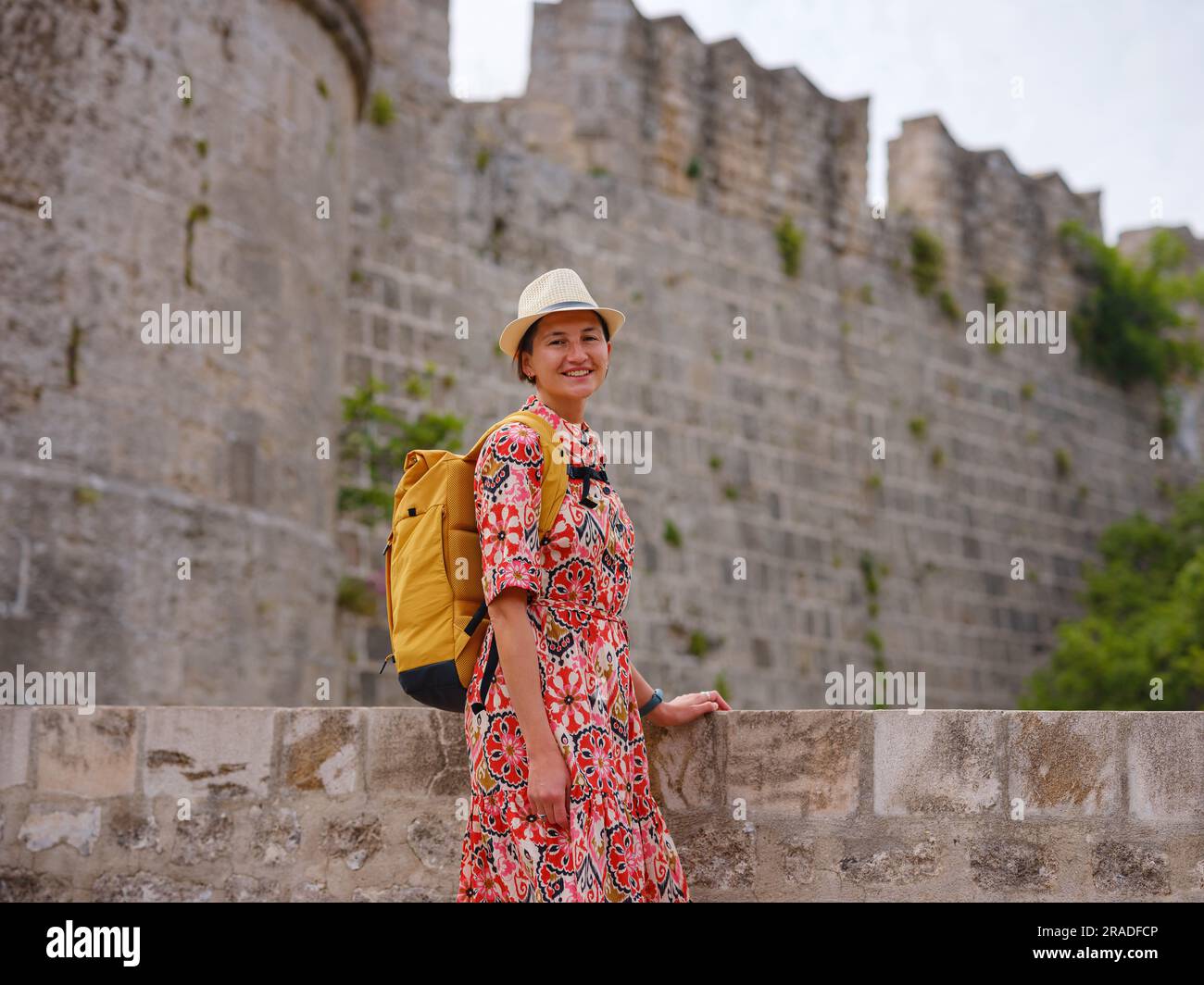 summer trip to Rhodes island, Greece. Young Asian woman in ethnic red ...