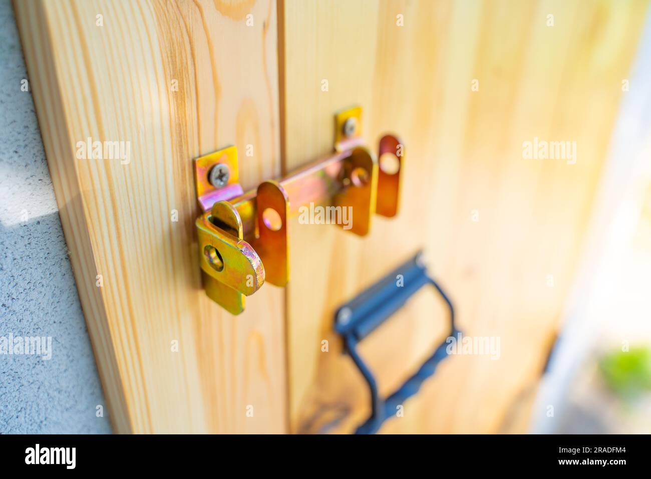 Garden decorative door latch of golden color on wooden doors of their ...