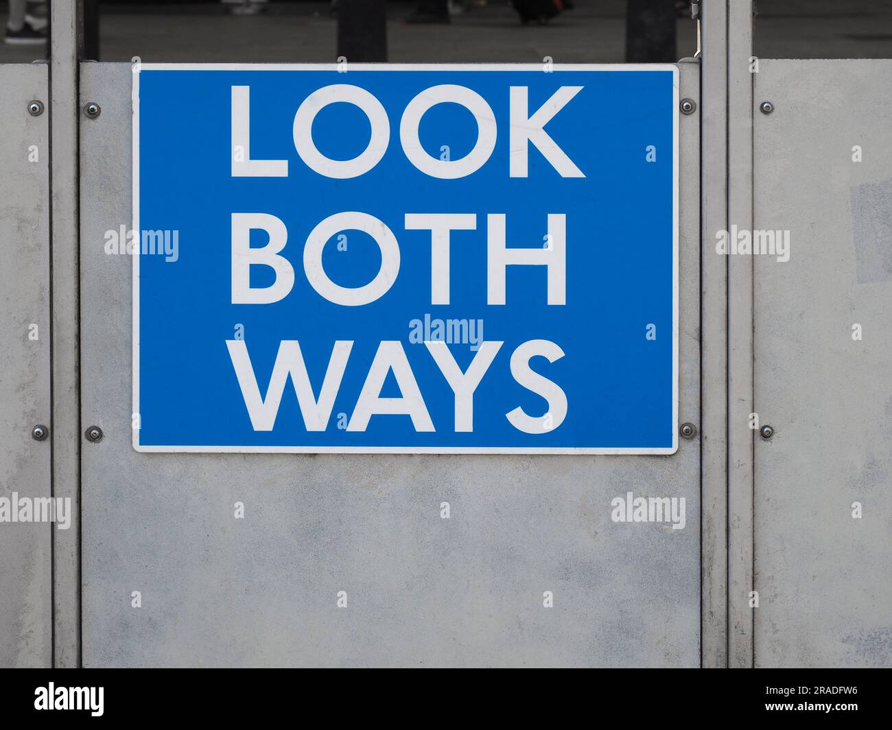 look both ways traffic sign in white over blue Stock Photo - Alamy