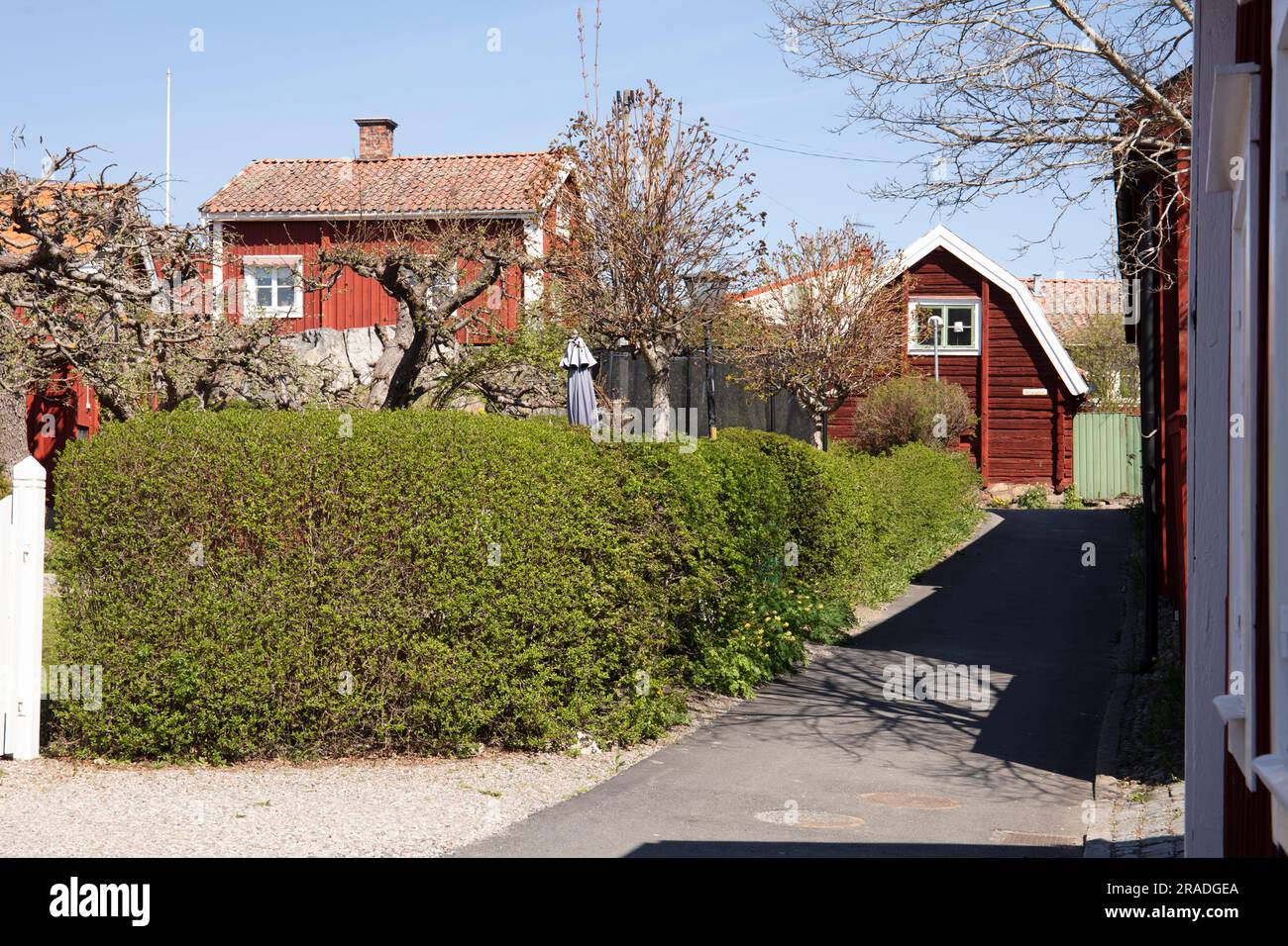 MARIEFRED, SWEDEN ON MAY 12, 2023. Outdoor view of a street, old wooden ...