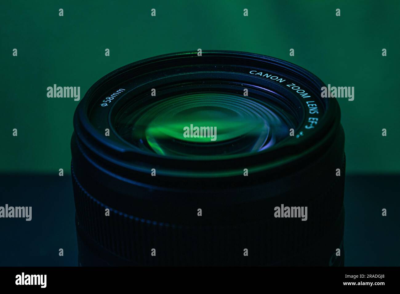 Canon Camera Lens with green light reflecting of the glass Stock Photo ...